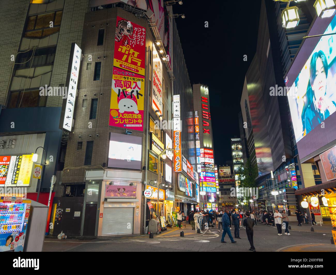 Shops and restaurants at night on Kabukicho Ichiban Gai Street in ...