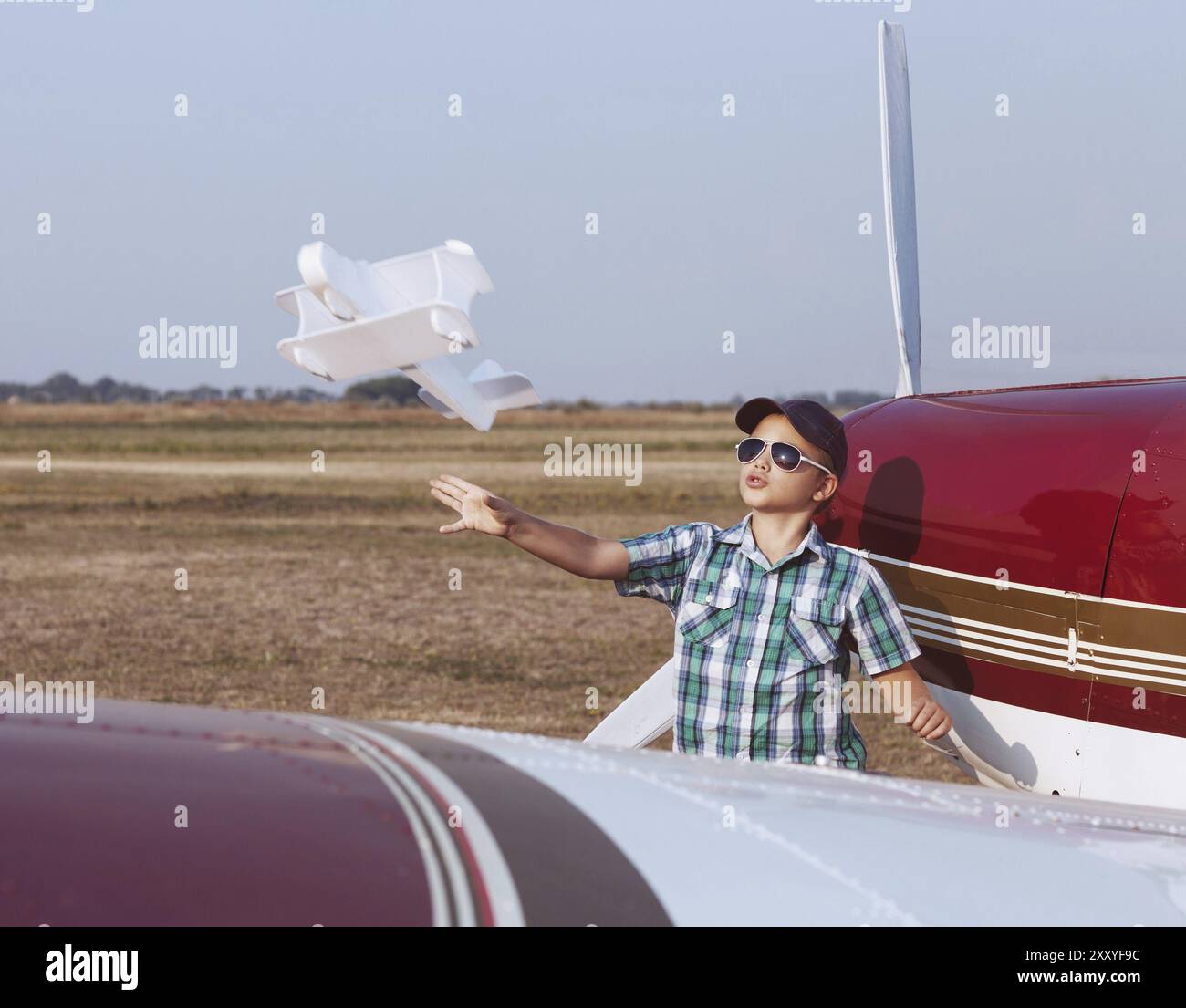 Little boy pilot with handmade plane at the airport Stock Photo - Alamy