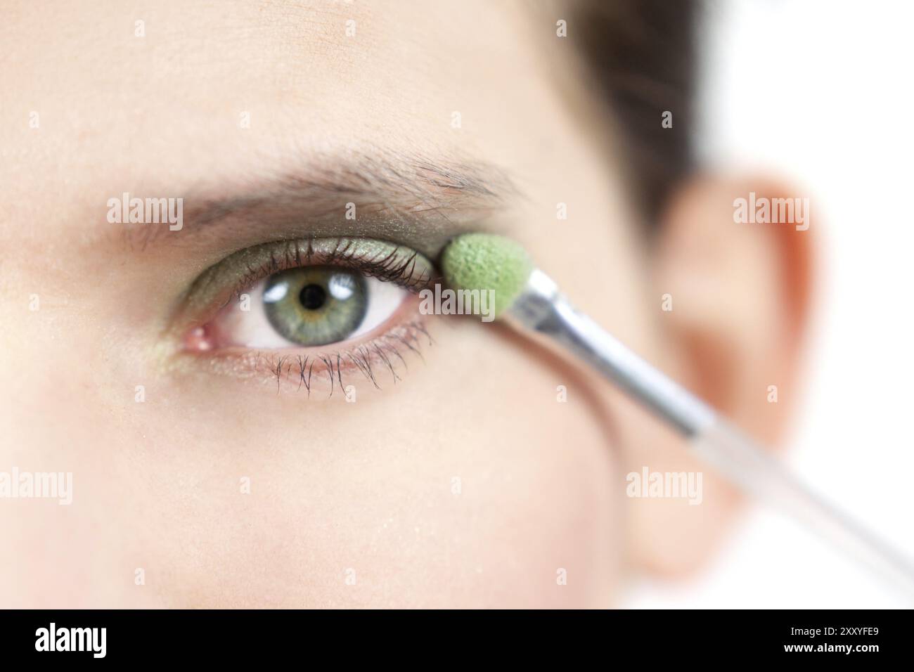 One eye makeup to paint face and put ones eye makeup on Stock Photo - Alamy