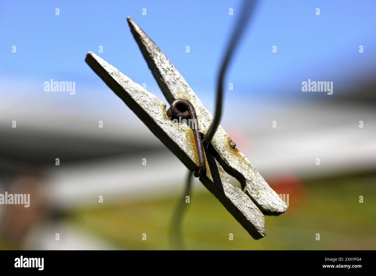 Old rusty wooden clothes peg on a line Stock Photo - Alamy