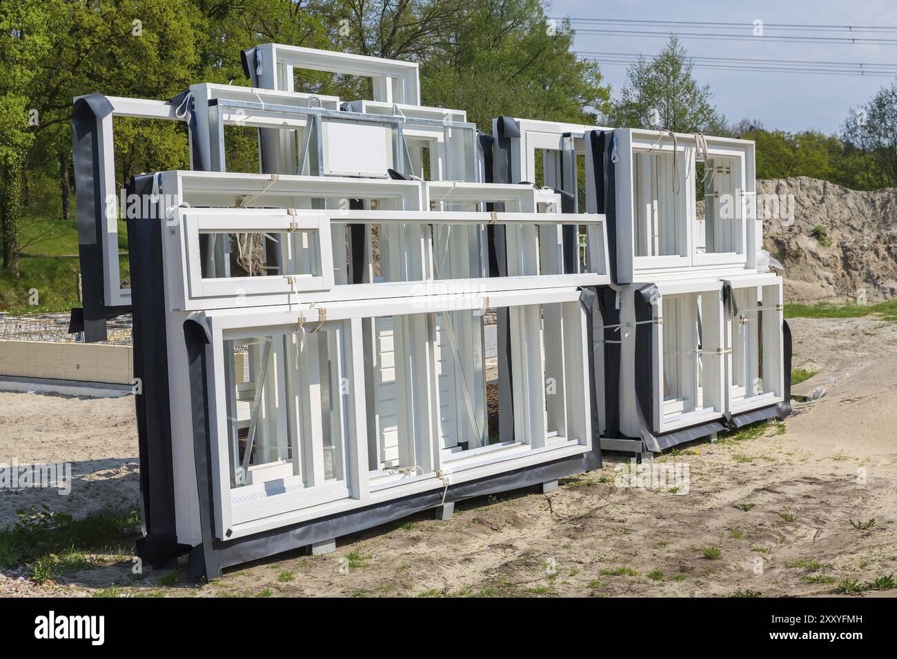 Group of white wooden window frames as delivery are outside Stock Photo ...