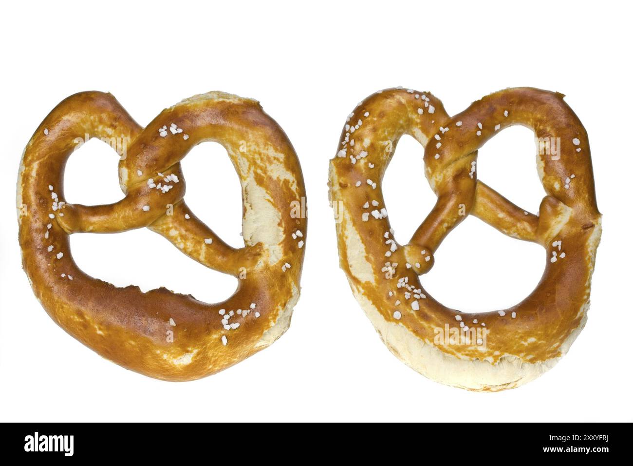 Two bavarian pretzels isolated on white Stock Photo - Alamy