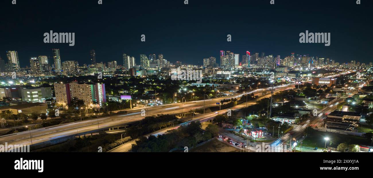 Aerial view of american freeway intersection at night with fast driving ...