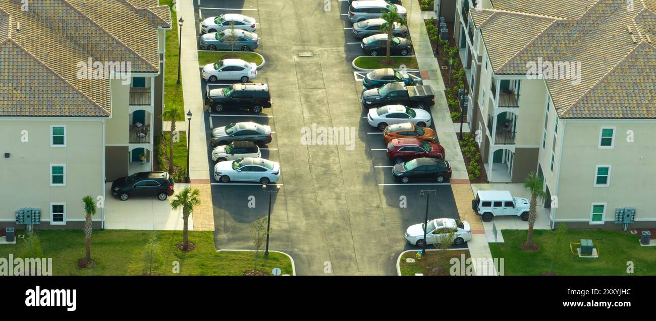 Aerial view of cars parked on parking places at american apartment ...