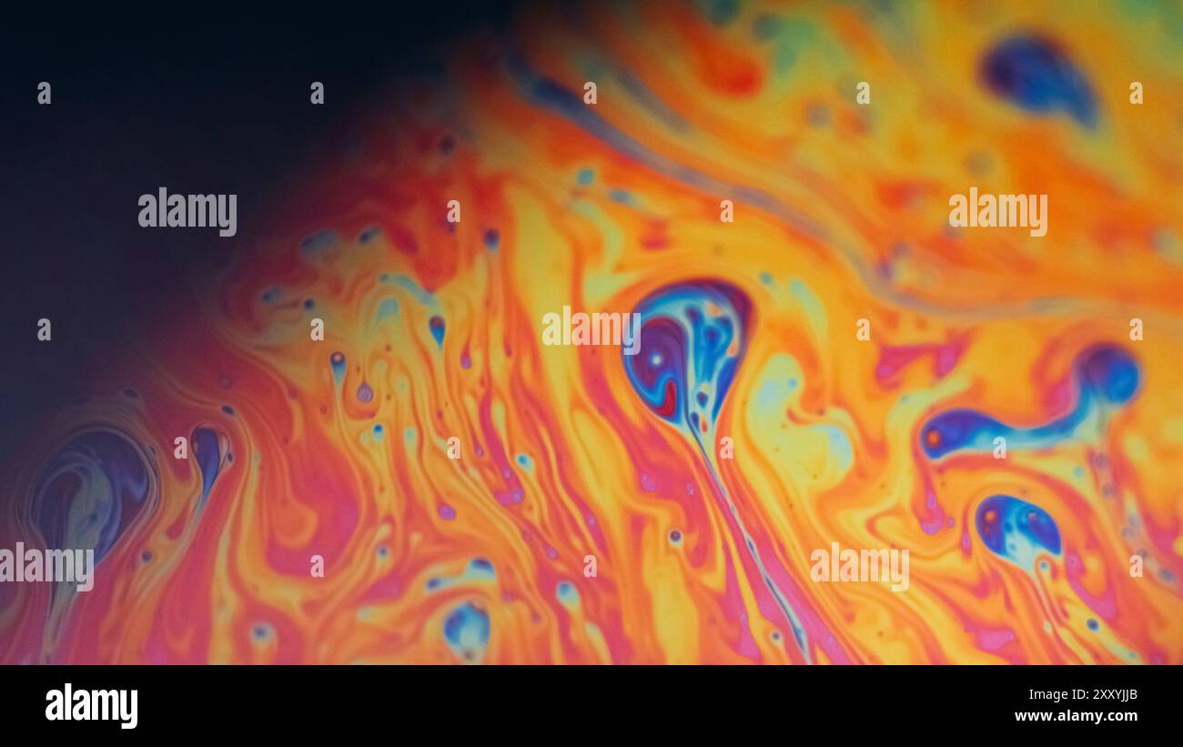 Blur psychedelic fluid. Paint mix. Defocused orange pink blue color ...