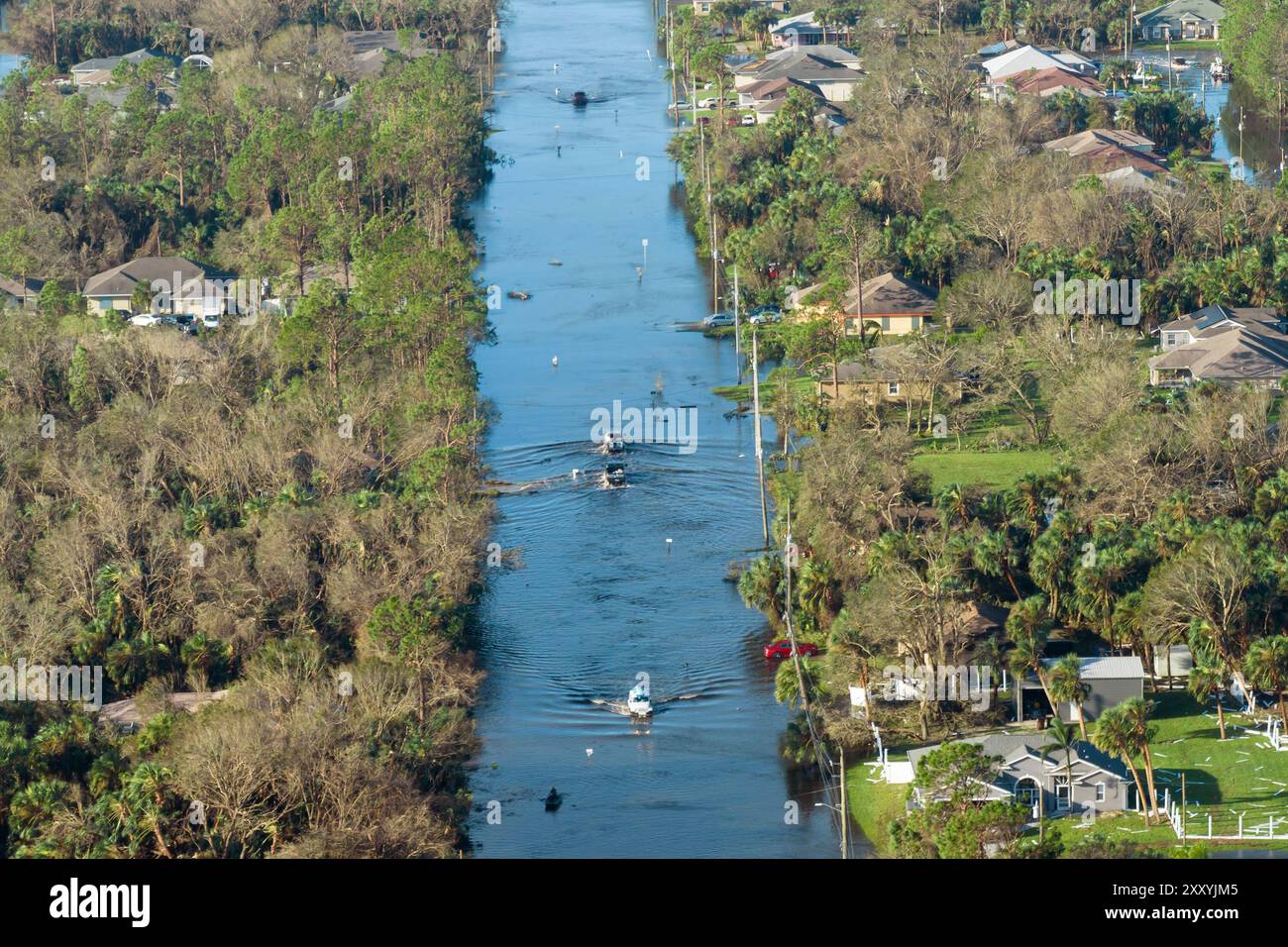 Aerial view of flooded street after hurricane rainfall with driving ...
