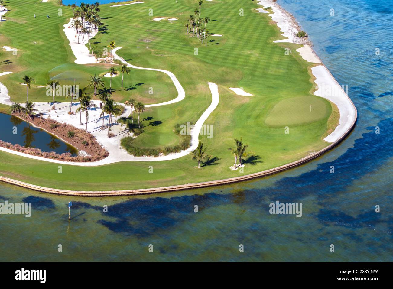 Aerial view of large golf field with green grass in Boca Grande, small ...