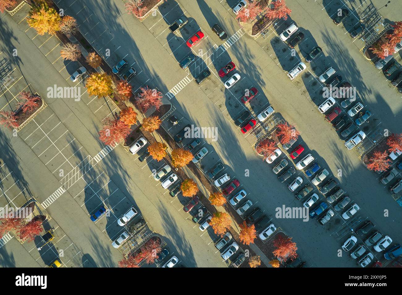 Aerial view of large parking lot with many parked colorful cars ...