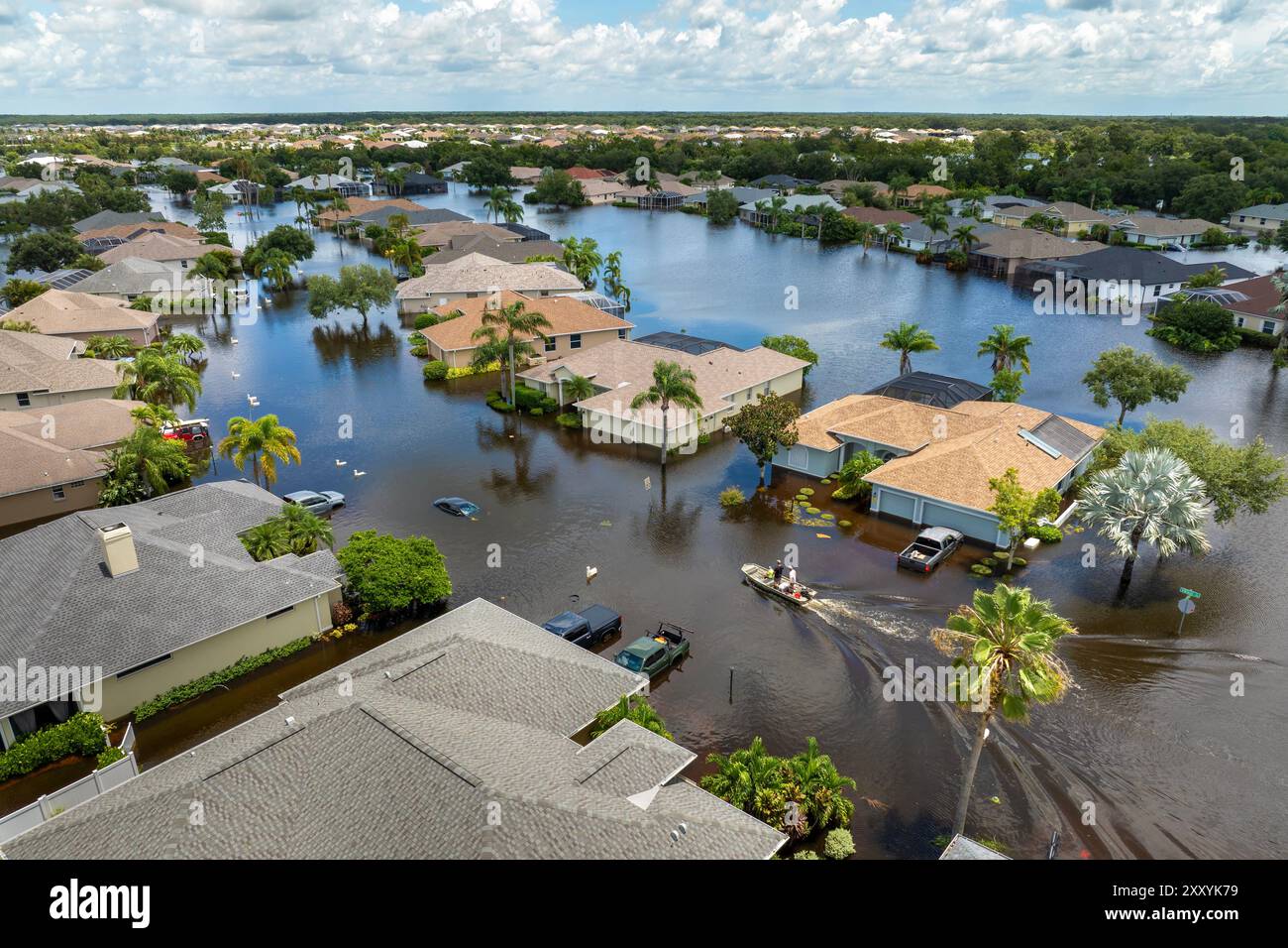 Aftermath of hurricane Debby flooding natural disaster. Boat floating ...