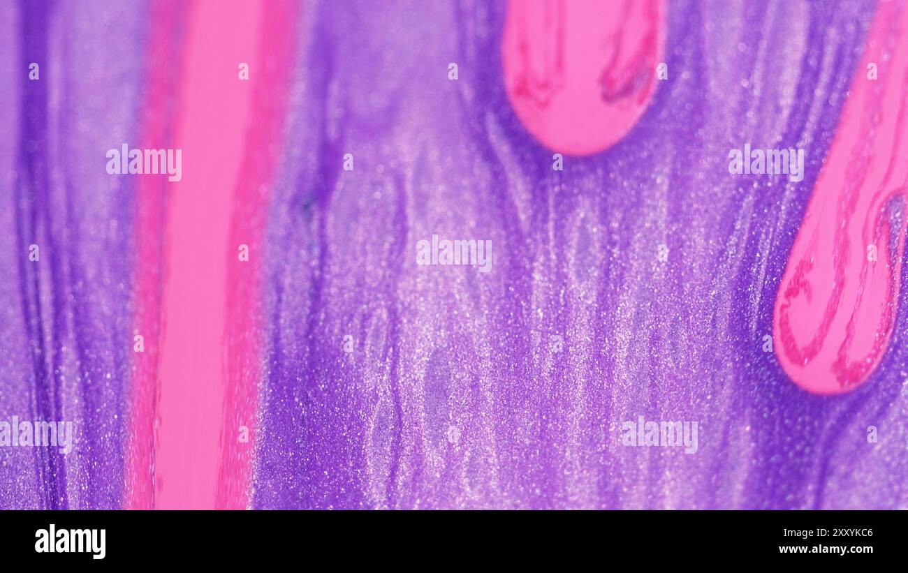 Glitter drop. Shiny ink. Defocused pink purple color spilling sparkling ...