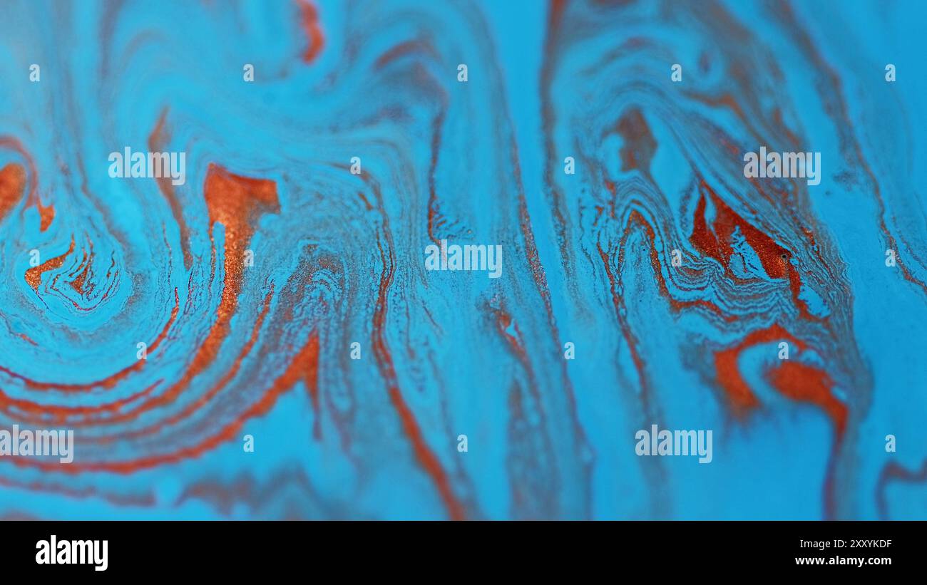 Paint flow. Wet sparkling texture. Defocused blue orange color ...