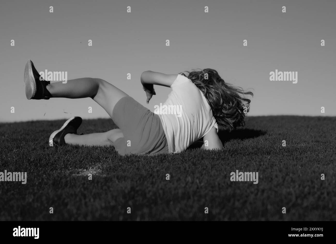 Kid runs and falling down. Moment of the kid fall down. Little child ...