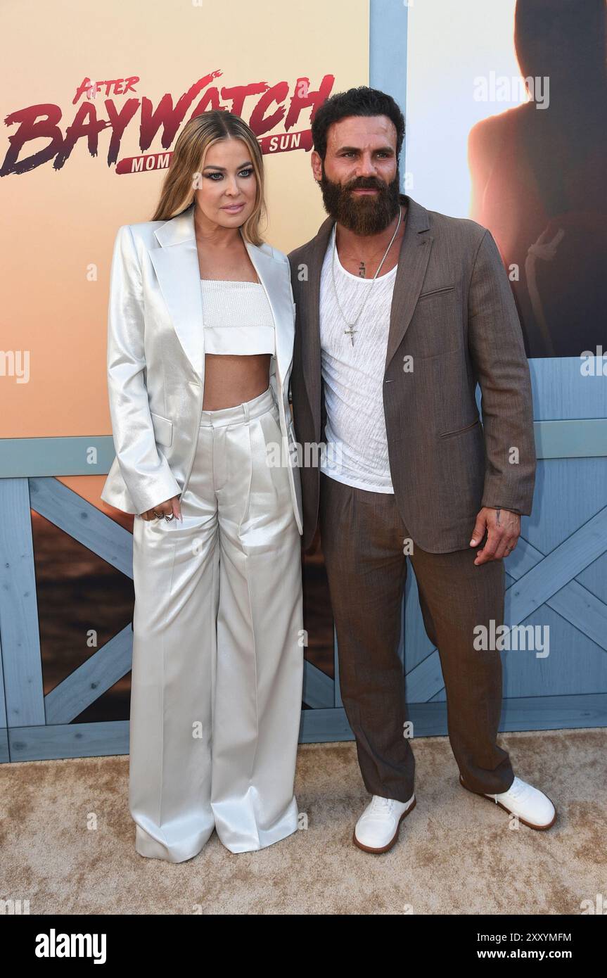 Carmen Electra, left, and Jeremy Jackson arrive at the premiere of ...