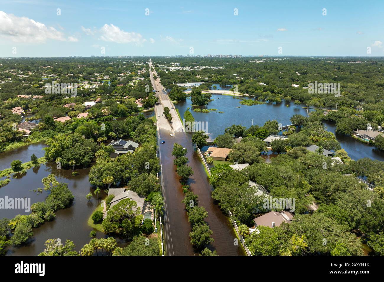 Hurricane flooded car on city street in surrounded with water Florida ...