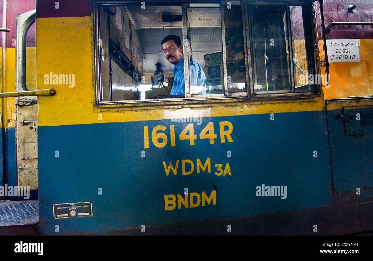 An engine driver of a train in India Stock Photo - Alamy