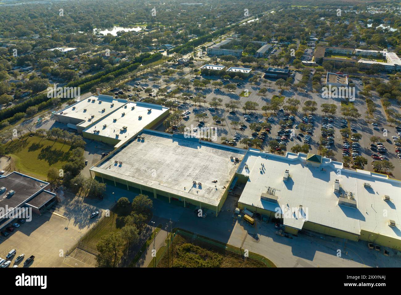 Many parked cars on store parking lot with lines and markings for ...