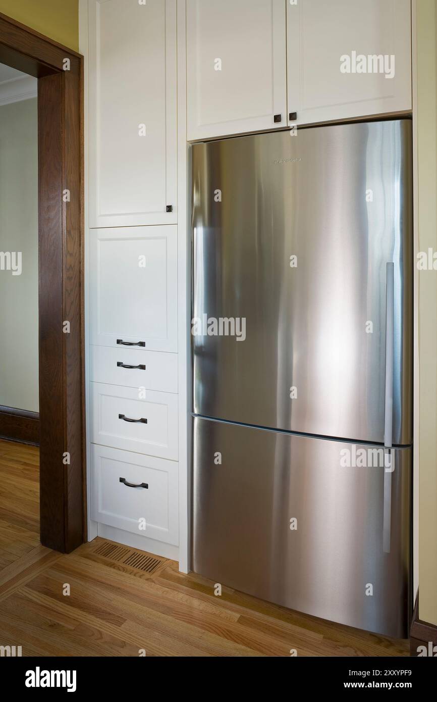 White kitchen cabinets surround refrigerator Stock Photo - Alamy