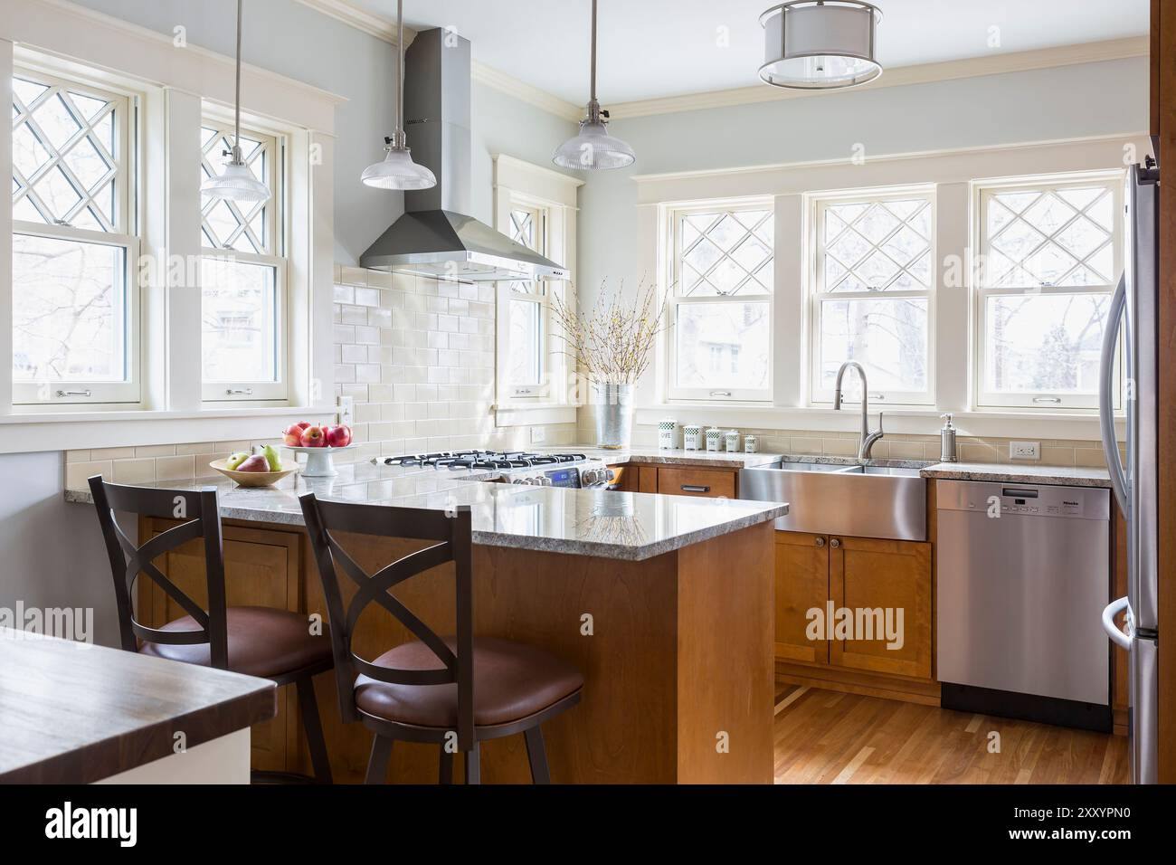 Light filled remodeled kitchen in older home with lots of windows Stock ...