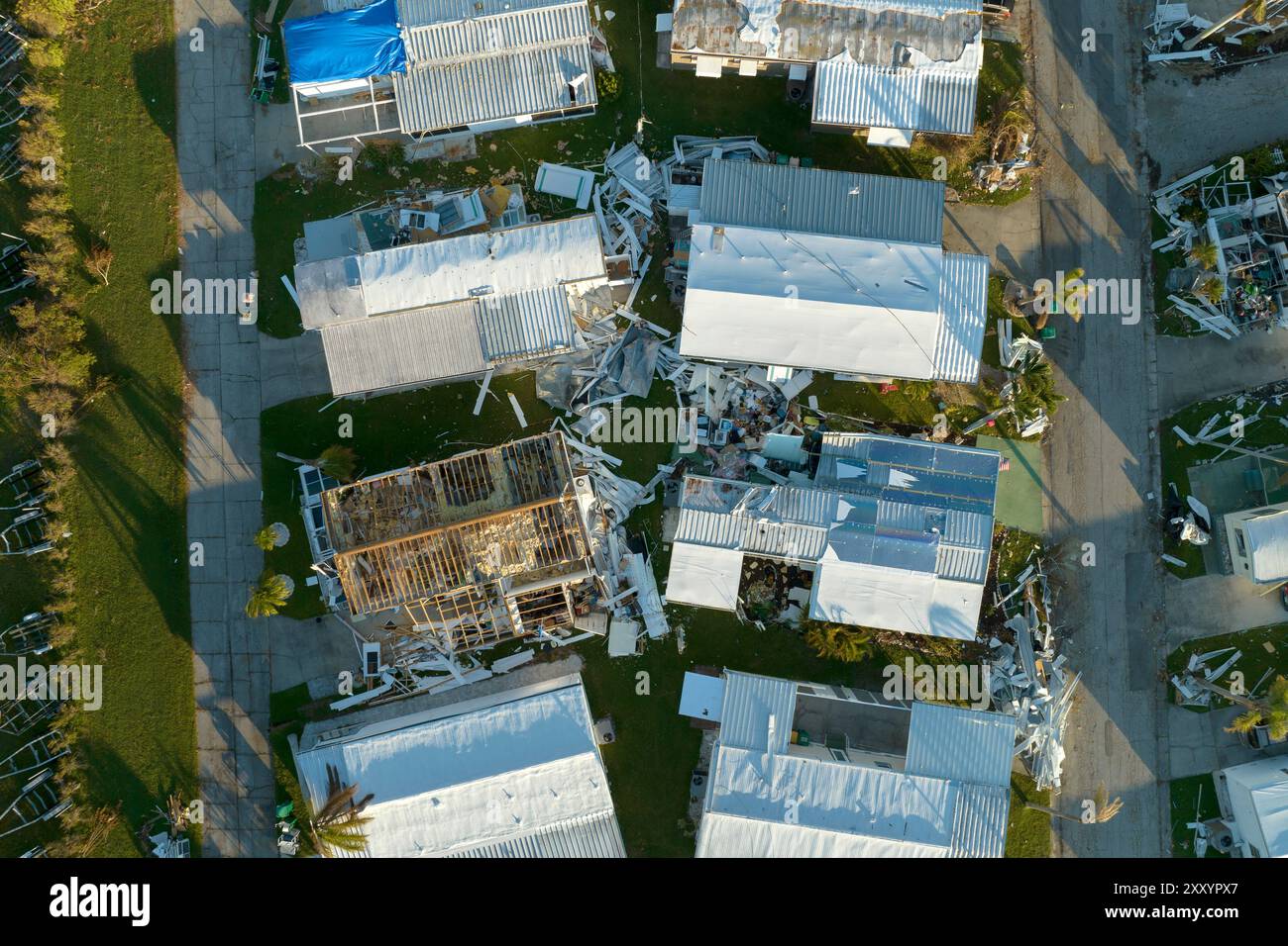 Wind damage of private houses after hurricane swept through Florida ...