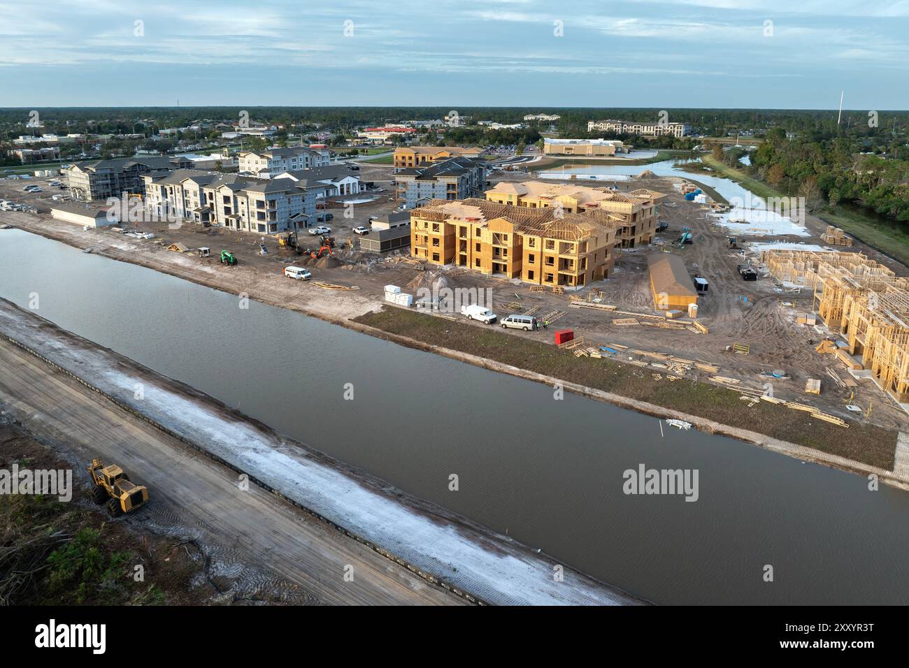 Wooden apartment buildings under construction in new developing ...