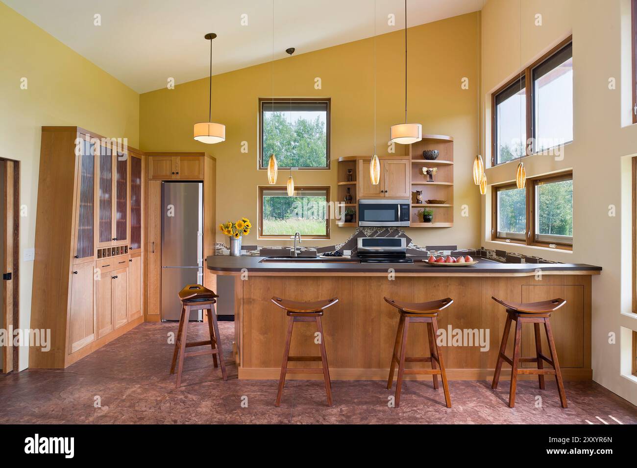 Full view of warm sunny kitchen with lots of windows in passive solar ...