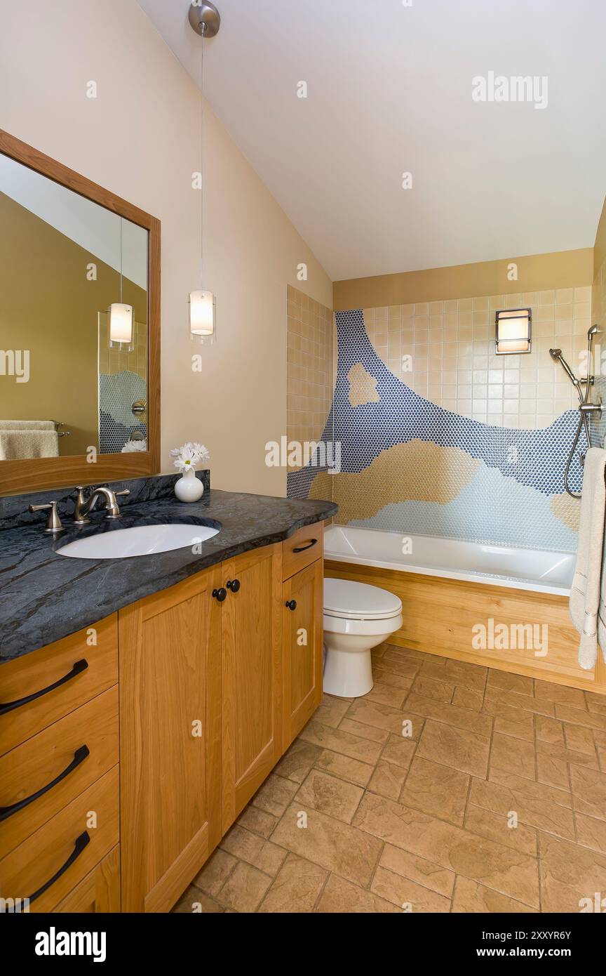 Bathroom with custom vanity and interesting pattern on tile around ...