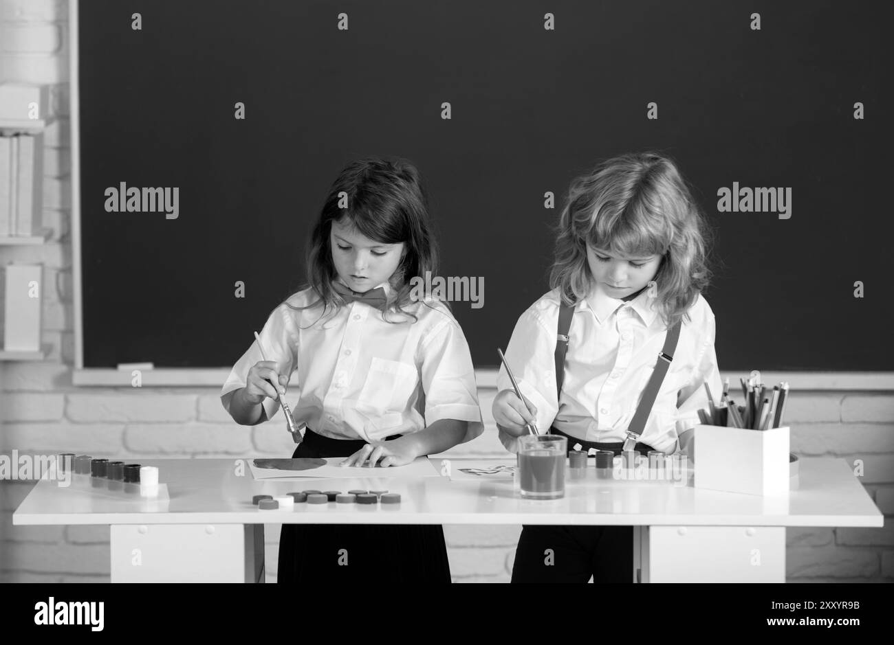 Kids creative growth. Portrait school kids doing art homework. Children ...