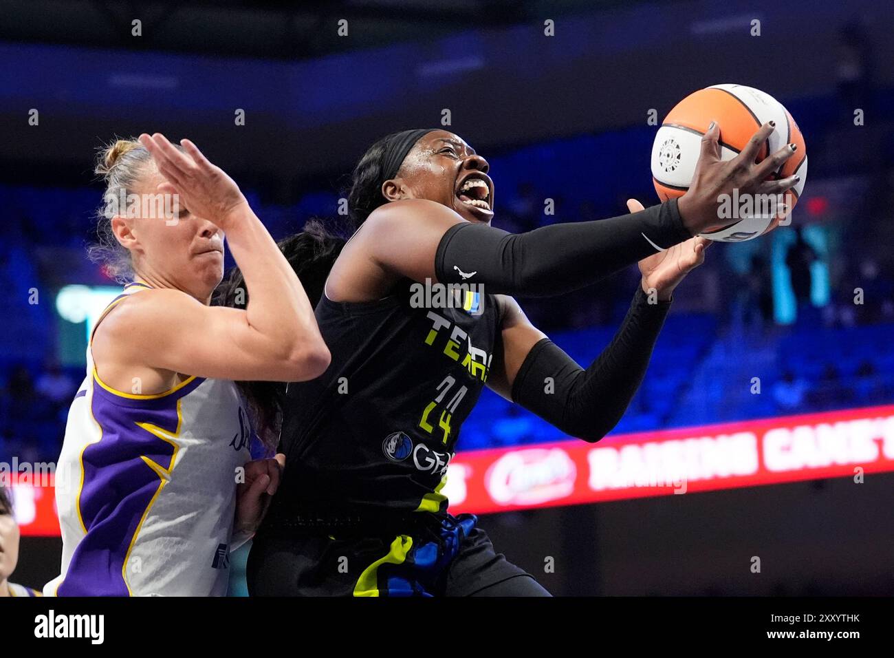 Dallas Wings guard Arike Ogunbowale (24) drives past Los Angeles Sparks ...