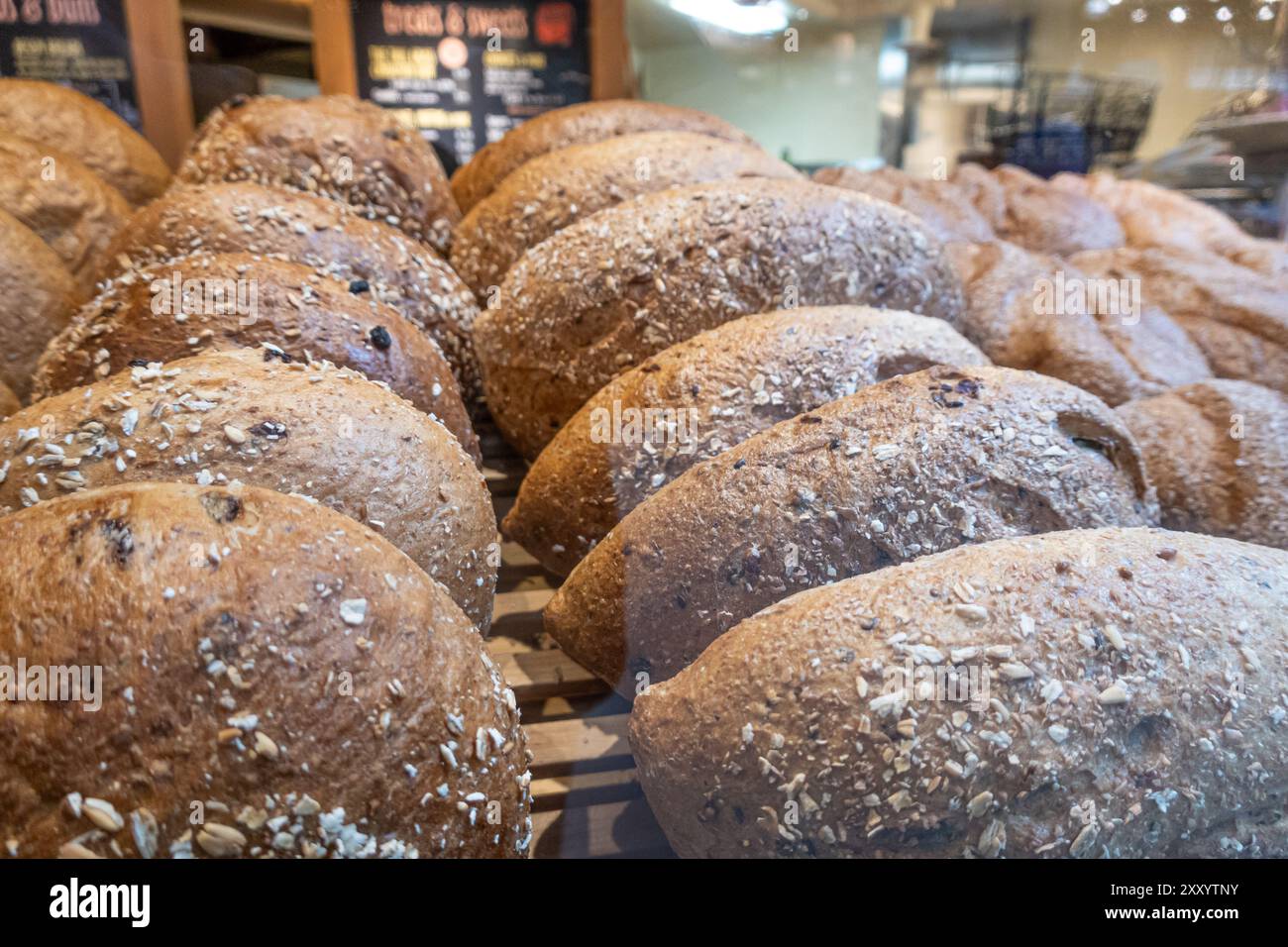 Loaves of Bread on Display in a bakery to sell Stock Photo - Alamy