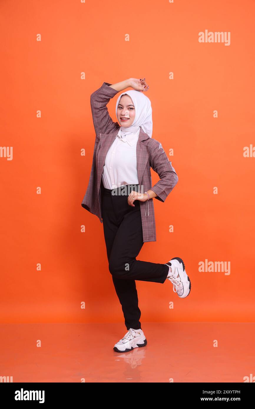 Full length portrait of beautiful Muslim asian girl model dancing ...