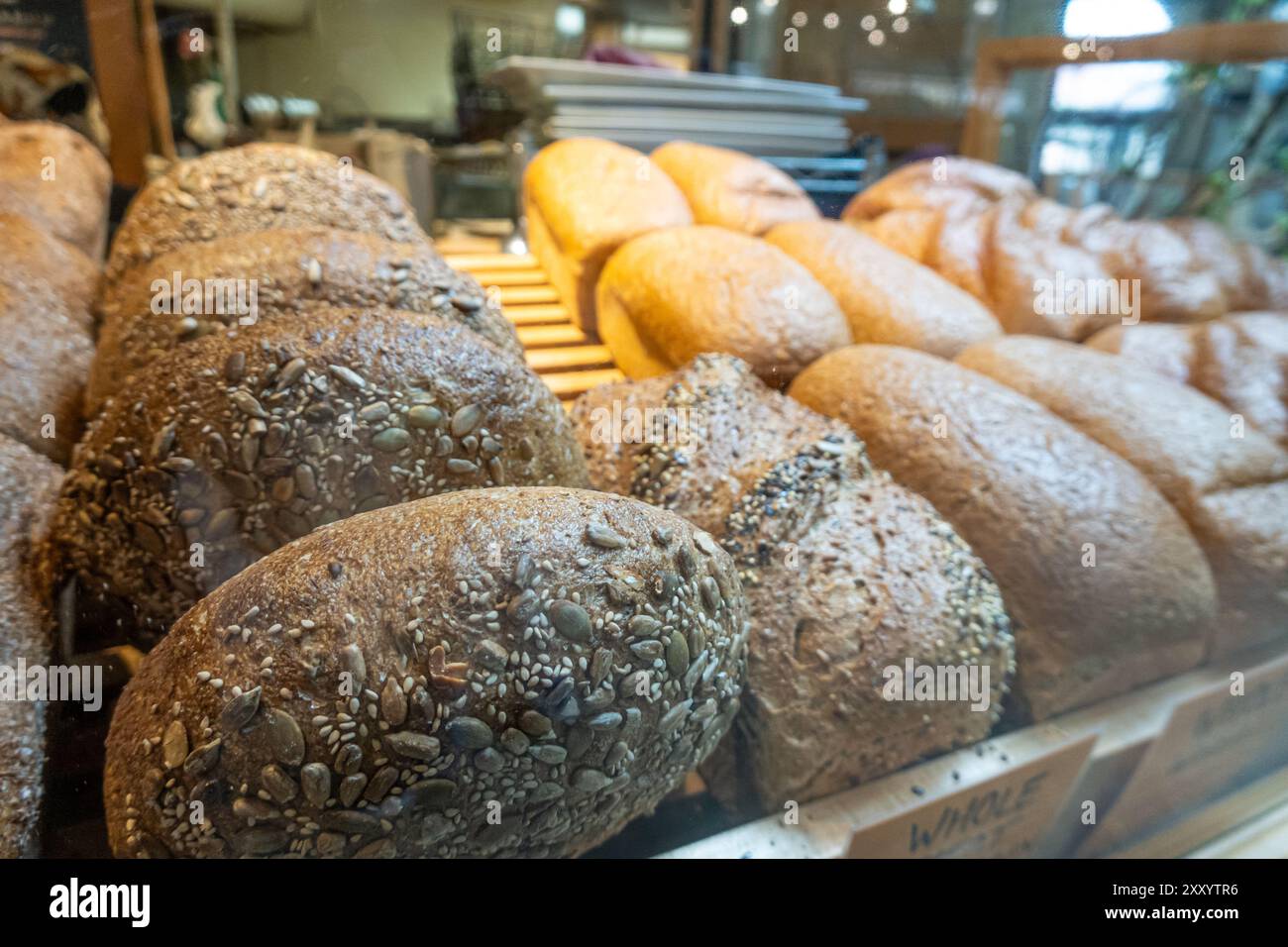 Loaves of Bread on Display in a bakery to sell Stock Photo - Alamy