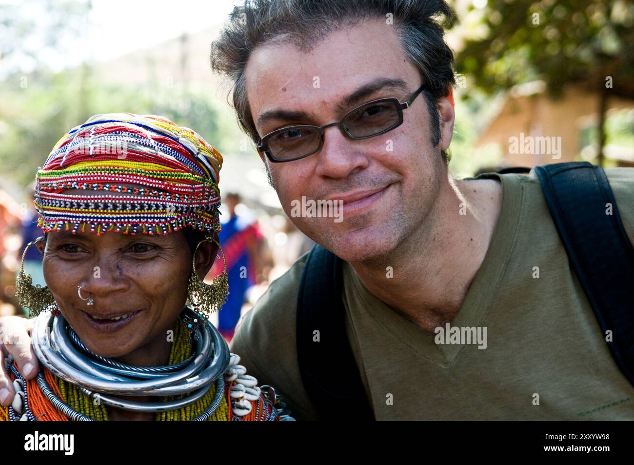 A traveler with a smiling Bonda tribal woman at the Malkangiri market ...