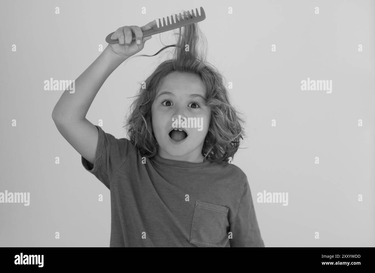 Morning kids after shower. Child with a comb and problem hair. Kids ...