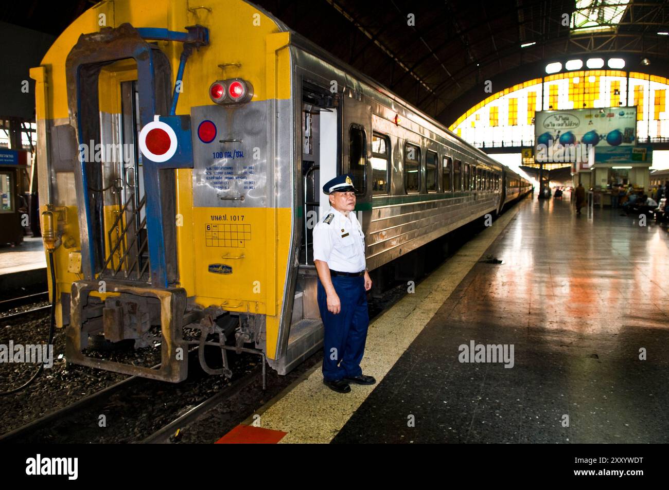 Thai train staff standing on the platform by the train at the Hua ...