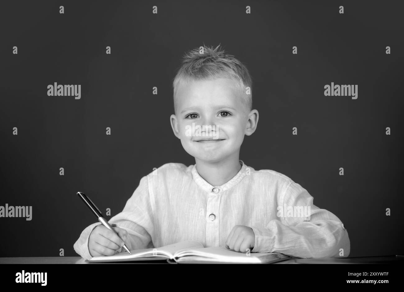 Kid writing in class. School child student learning in class, study ...