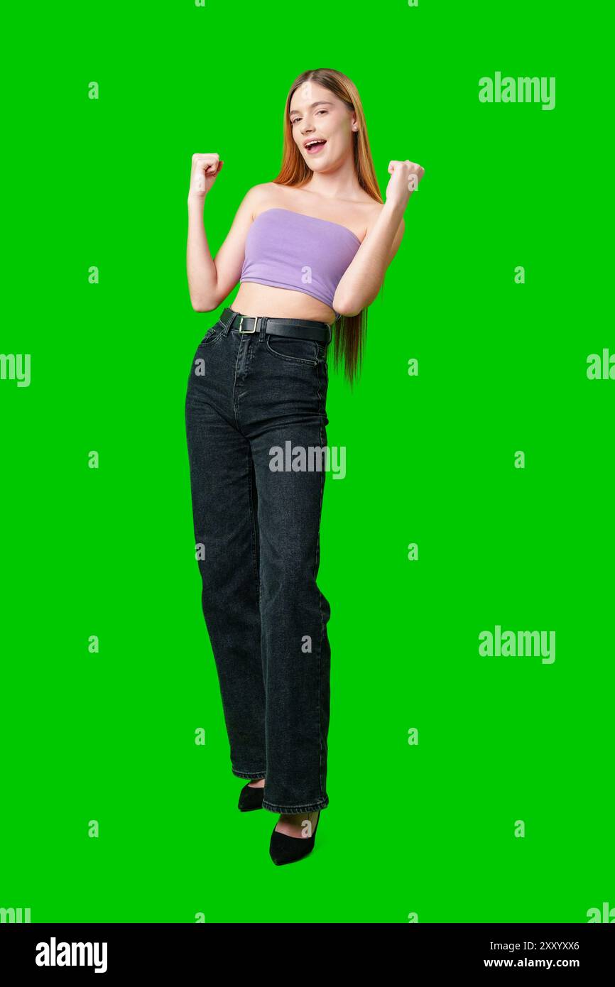 Young Woman Flexing Bicep Against Green Screen Stock Photo - Alamy