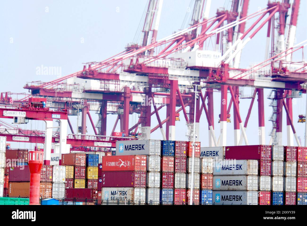 Aerial photo shows cargo ships loading and unloading containers at ...