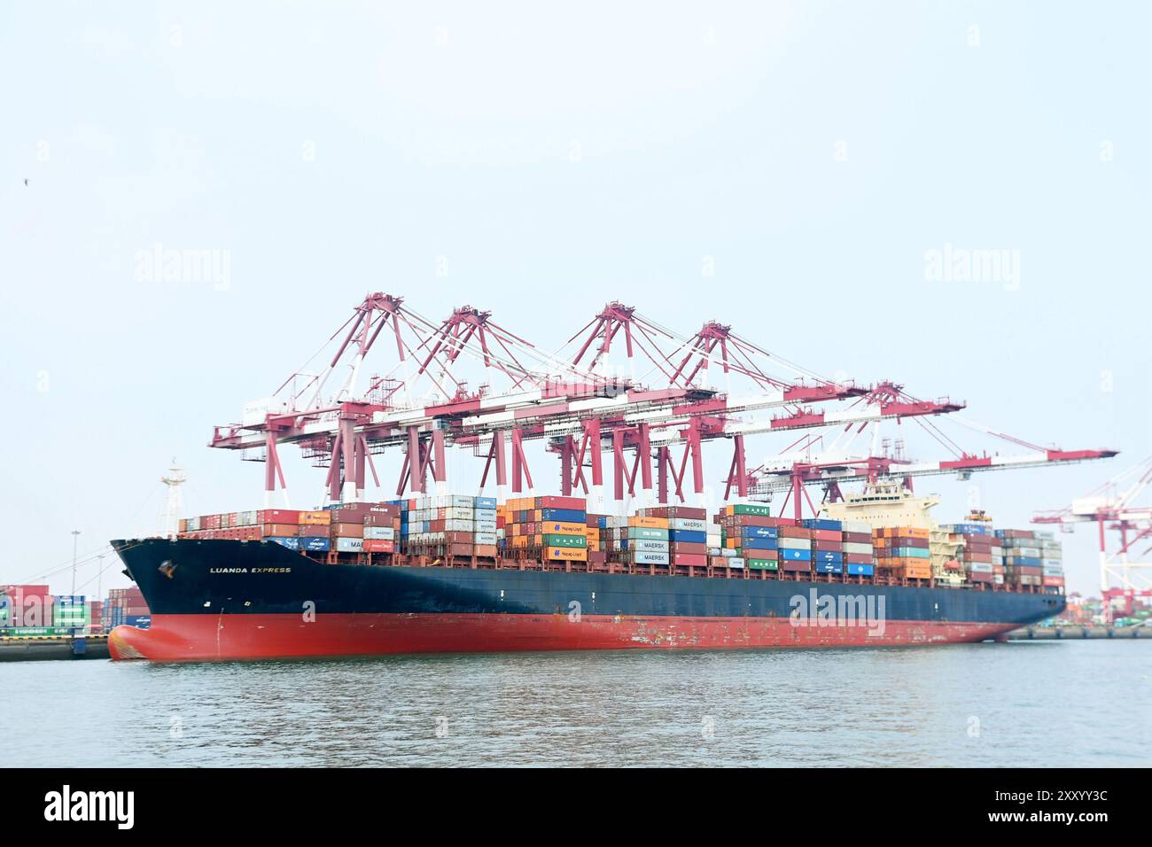 Aerial photo shows cargo ships loading and unloading containers at ...