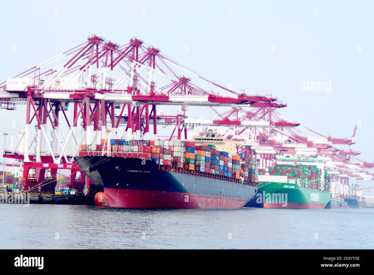 Aerial photo shows cargo ships loading and unloading containers at ...