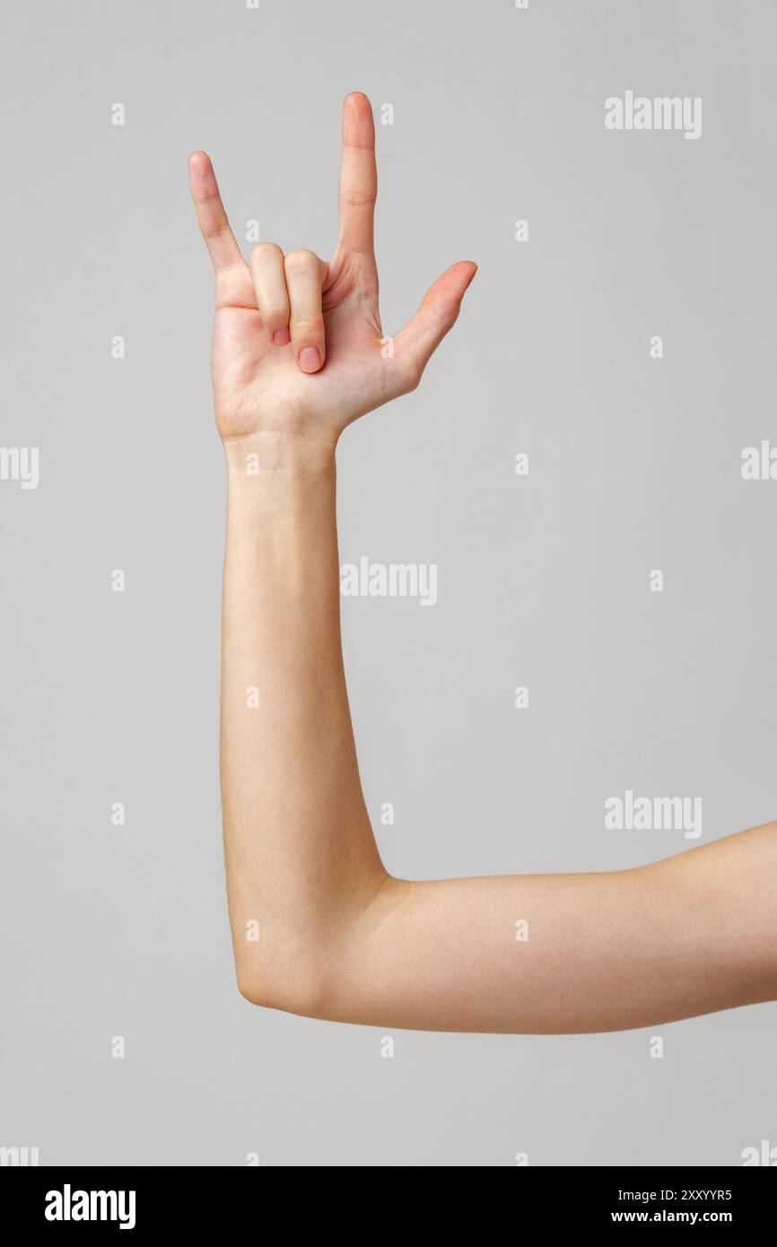 Woman wrist hand rock symbol hi-res stock photography and images - Alamy