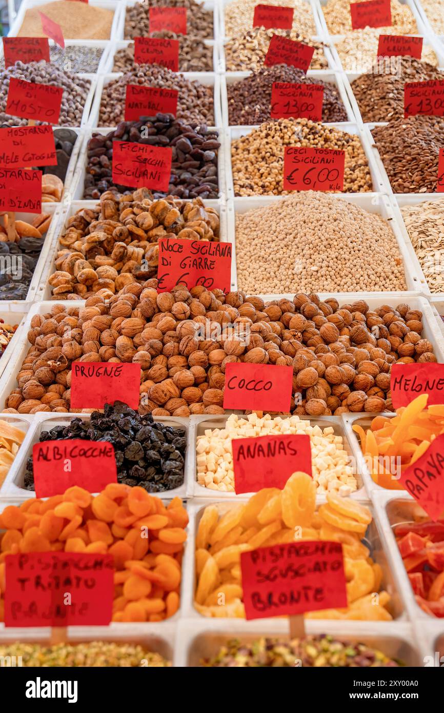 Colorful display of various nuts, dried fruits, and seeds at an Italian ...