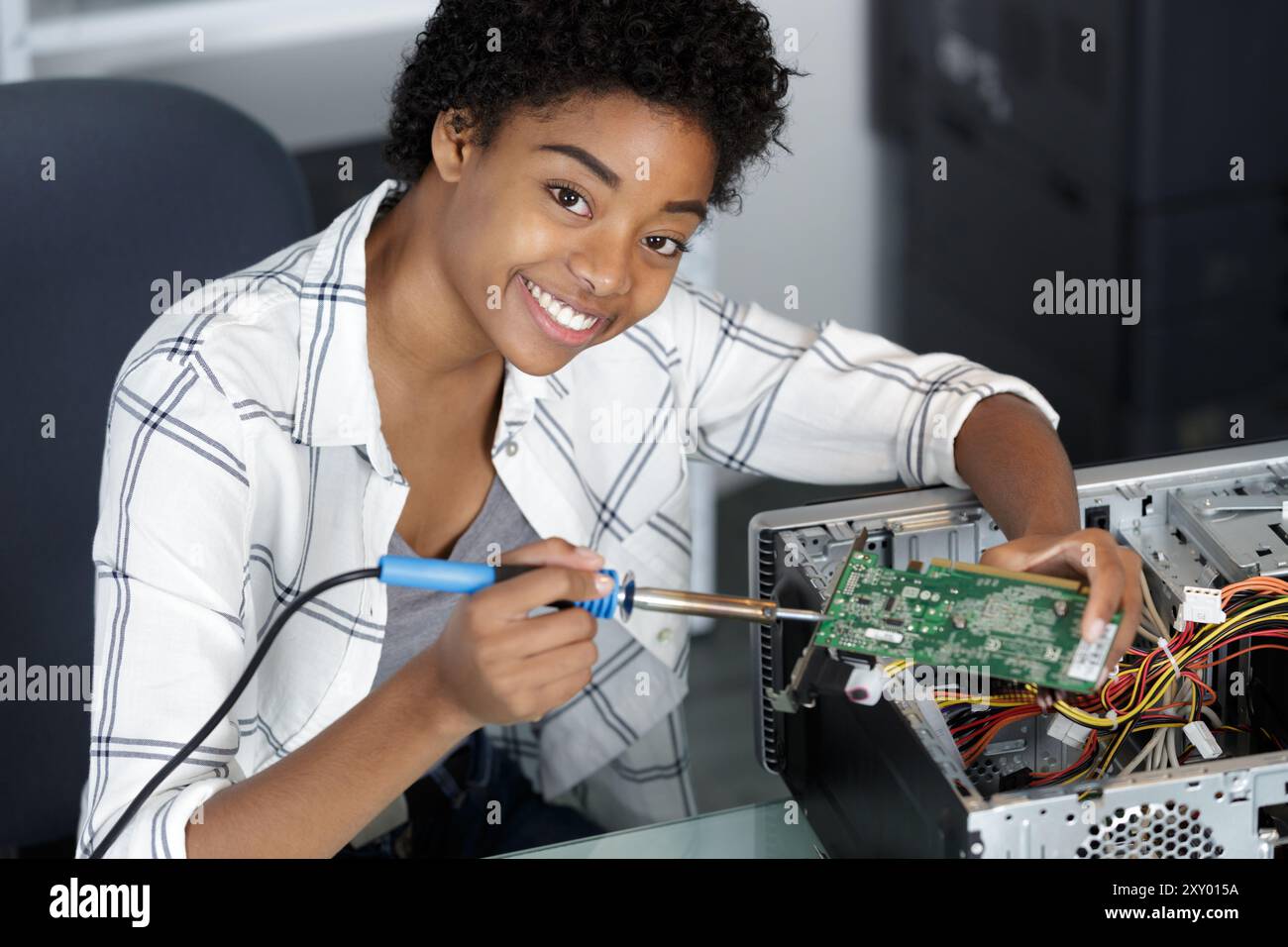 female engineer fixing broken computer hard drive Stock Photo - Alamy