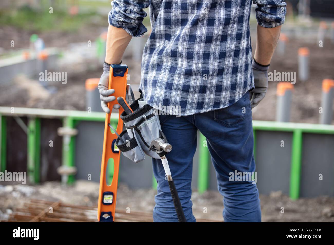 a construction worker control in the construction Stock Photo - Alamy