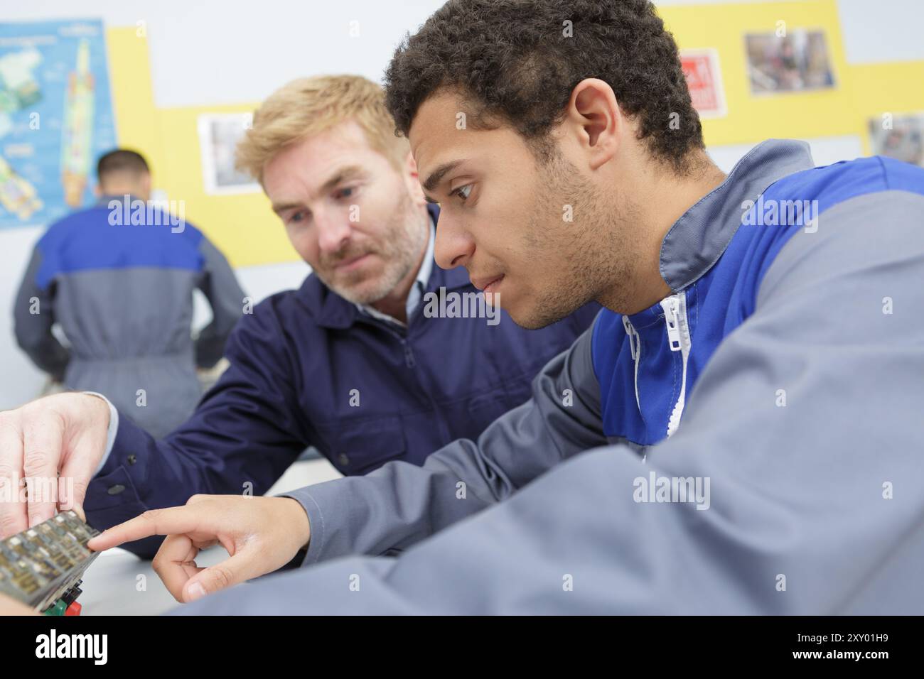 technician pointing at machine defect Stock Photo - Alamy