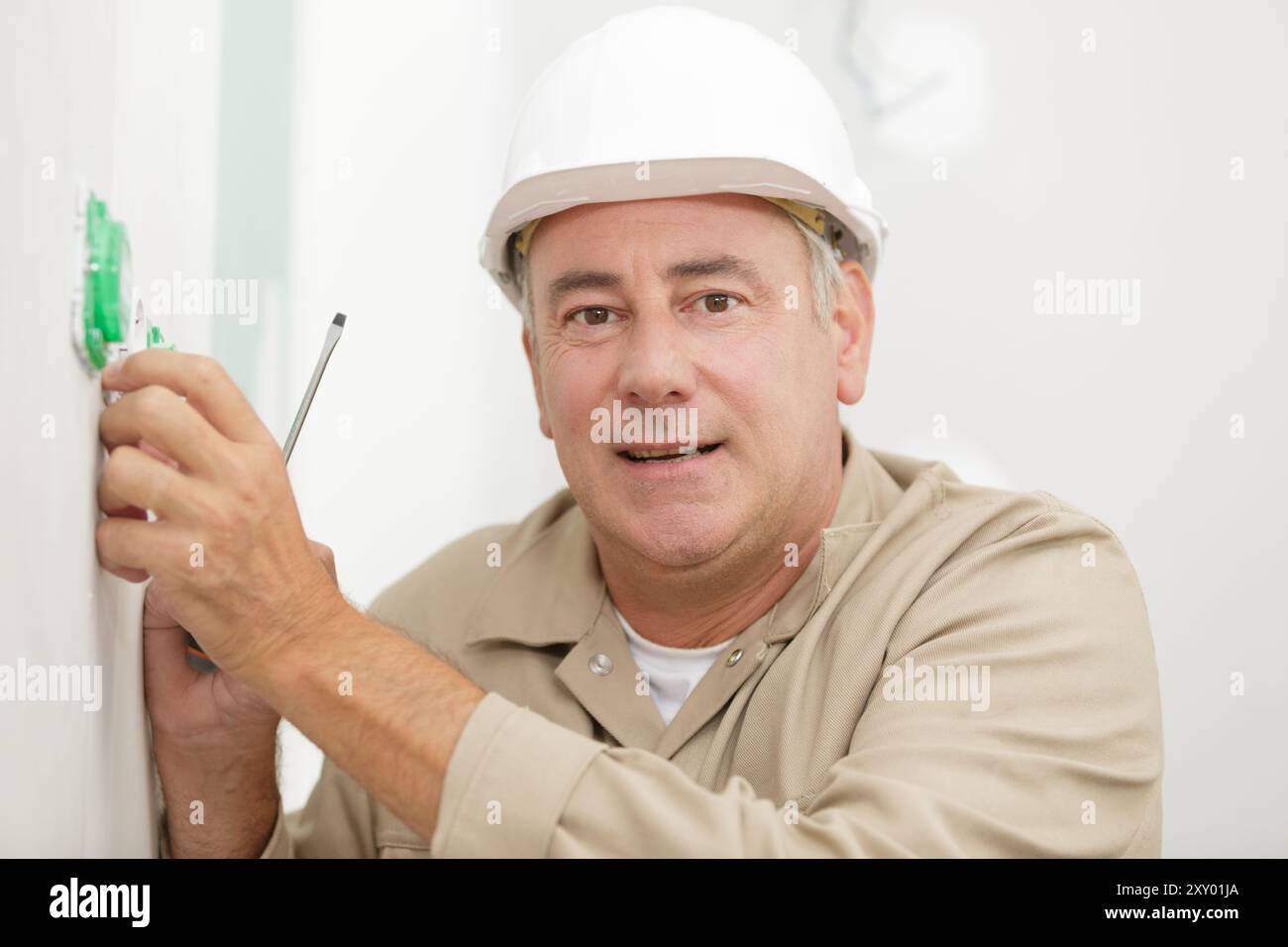 an electrician socket installing socket Stock Photo - Alamy