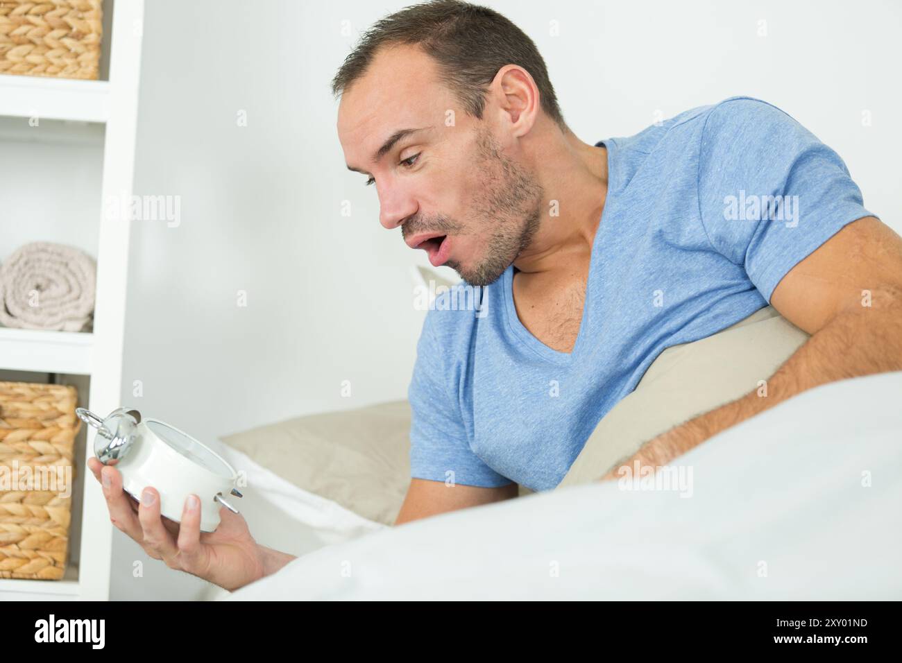 man shocked as he wakes up late for an appointment Stock Photo - Alamy