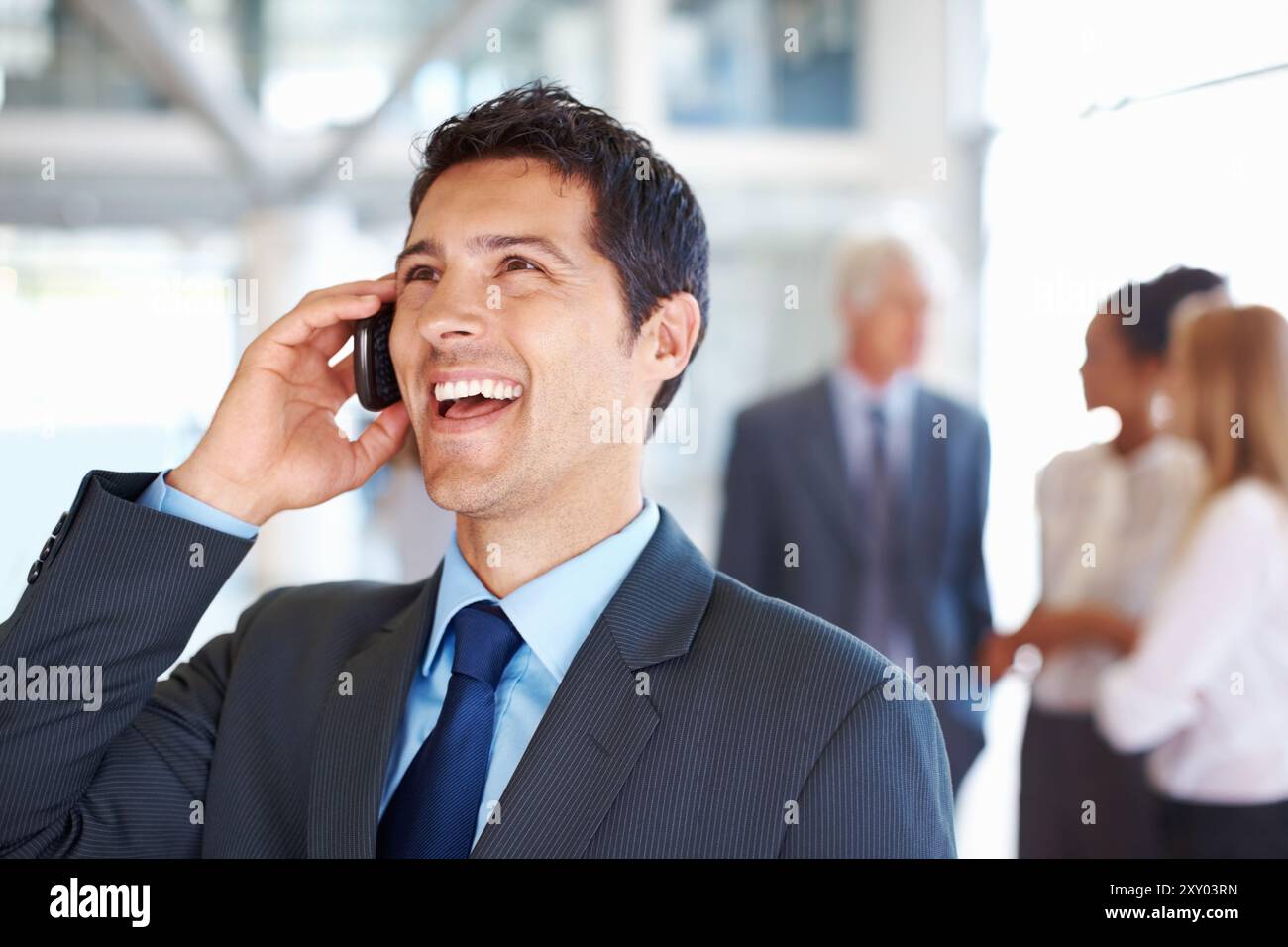 Businessman, phone call and laugh for conversation in office, talking ...