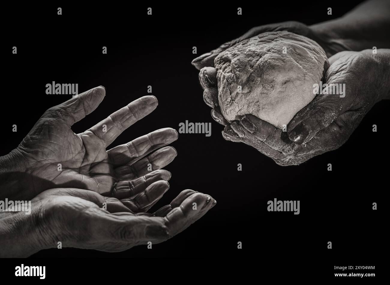 Woman 's hand give a loaf of bread to hands of a beggar. Poverty and ...