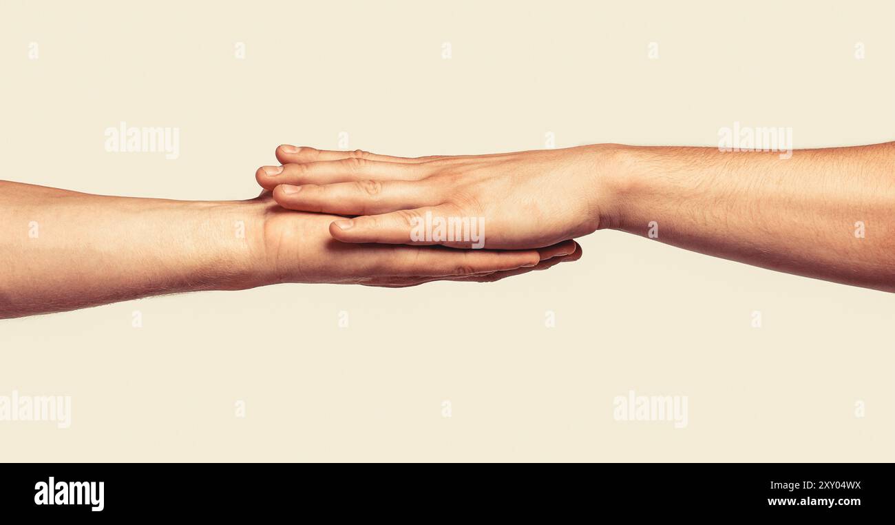 Man and woman hands holding each other, close-up. Two hands touching ...