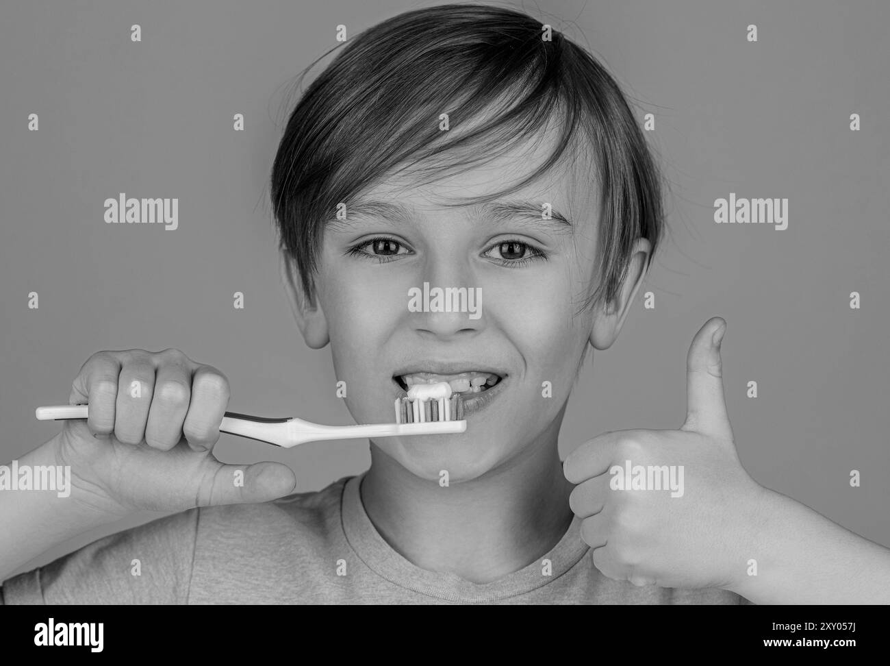 Little boy cleaning teeth. Smile child shows toothbrushes, shows a ...